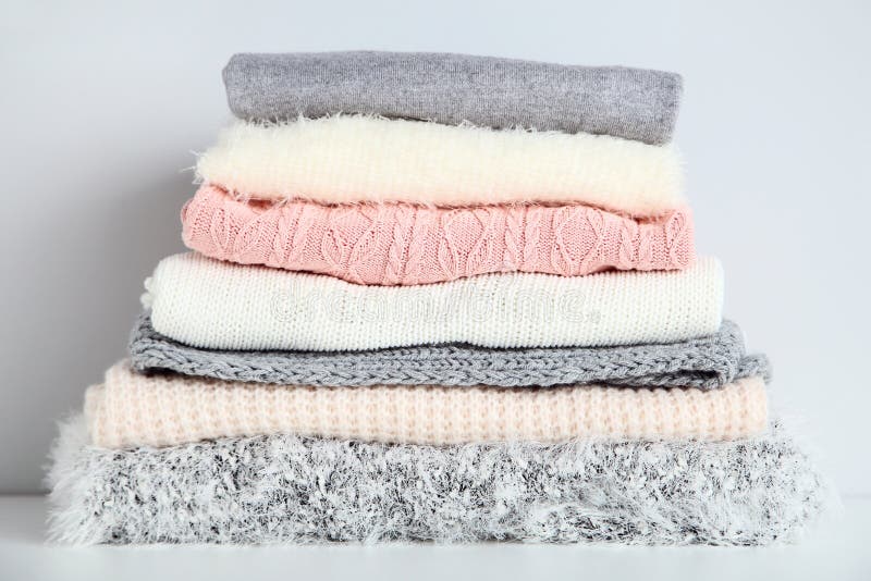 Folded sweaters stock image. Image of color, grey, laundry - 131529355
