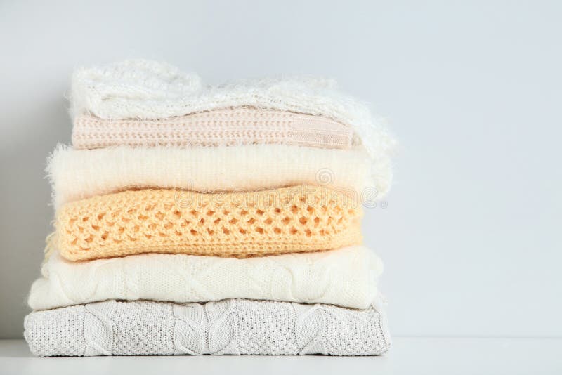Stack of folded sweaters stock photo. Image of shape - 134624548