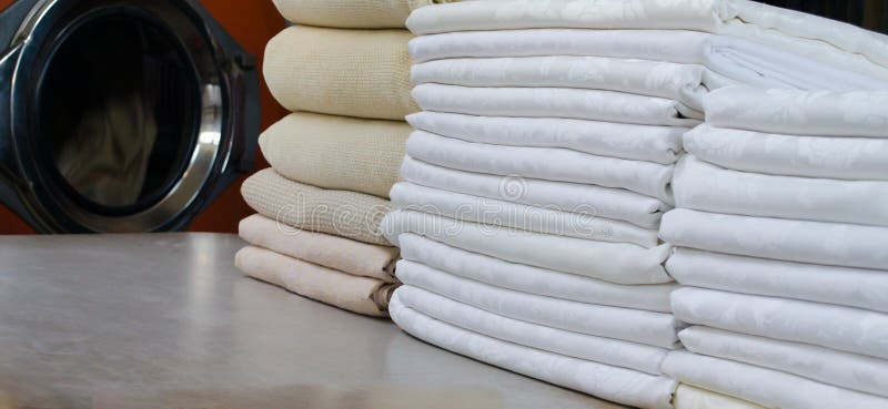 Stack of Folded White Cloths in an Industrial Laundry Stock Image ...