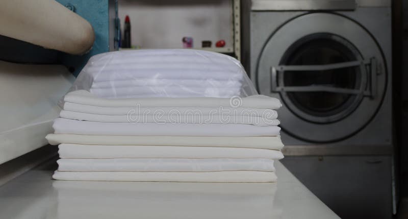 Stack of Folded White Fabrics in an Industrial Laundry Stock Photo ...