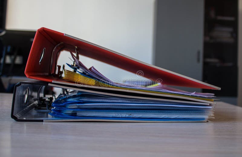 A Stack of Folders with Documents on the Table Stock Photo - Image of ...