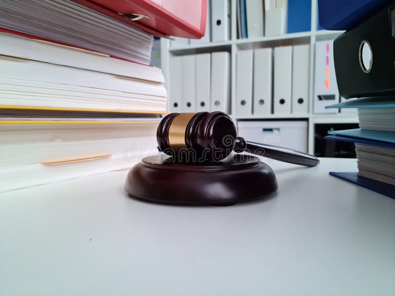 Stack of Folders and Judge Gavel on Table Stock Photo - Image of system ...