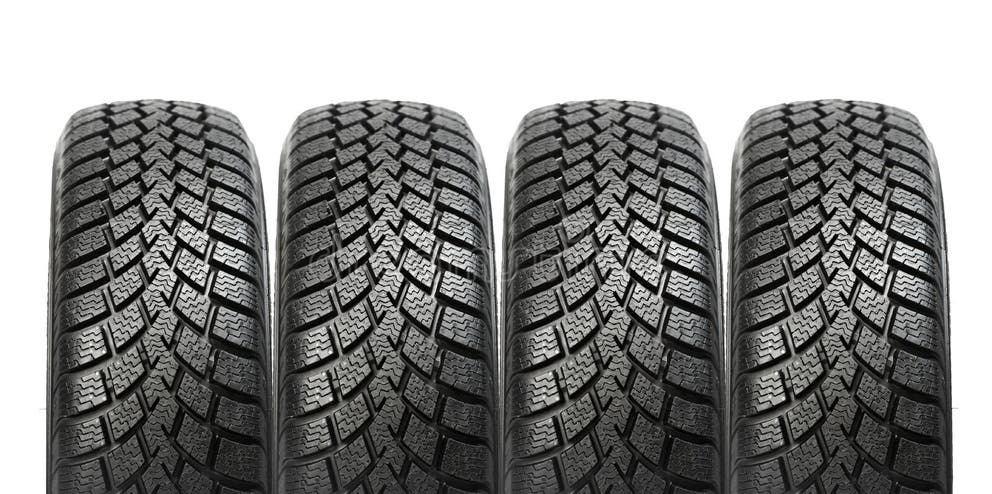 Stack of Four Car Wheel Winter Tires Isolated Stock Photo - Image of ...
