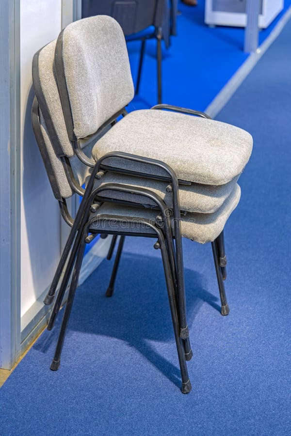 Stacked Office Chairs stock photo. Image of carpet, stack - 246747078