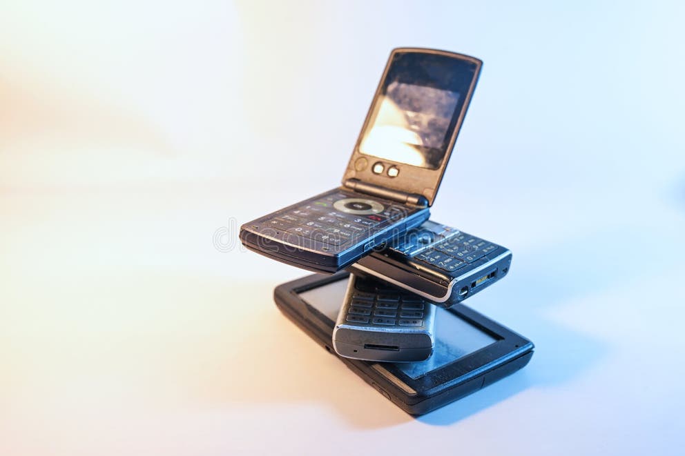 Stack of Four Old Mobile Phones, Short-lived Electronic Waste of ...