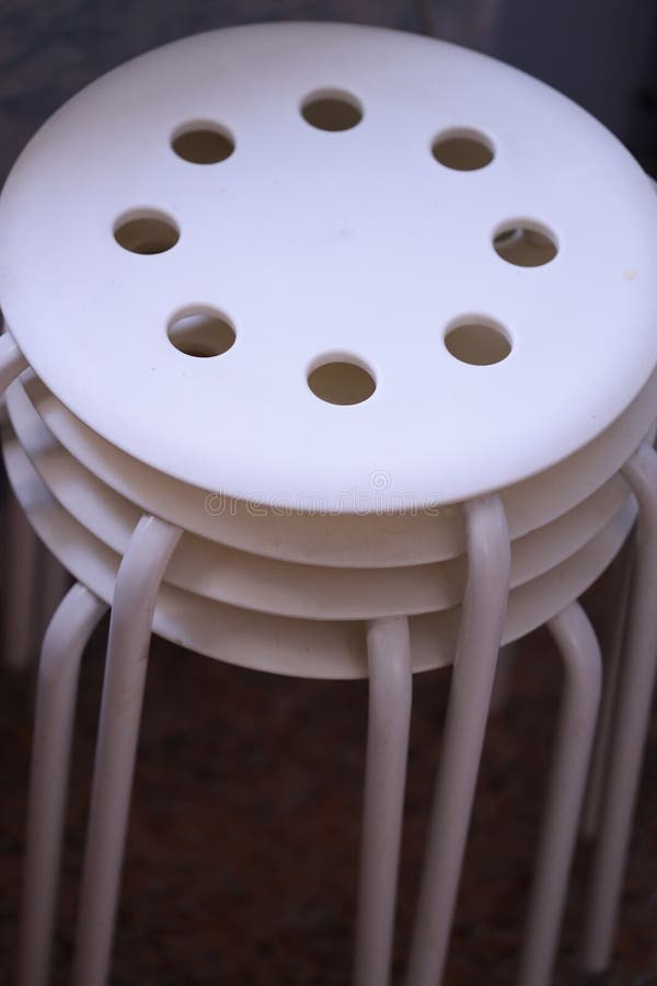 A Stack of Four White Plates Sits on Top of a Radiator Stock Photo ...