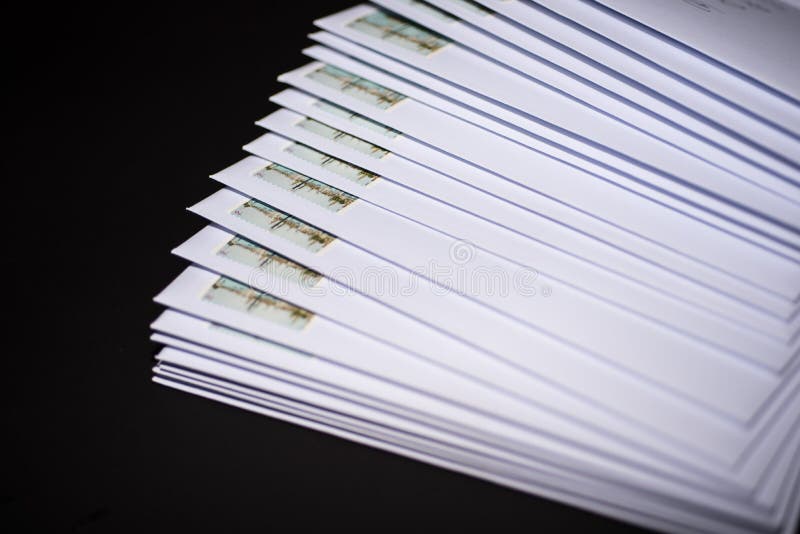 Stack of Franked Letters in White Envelopes on Black Background Stock ...