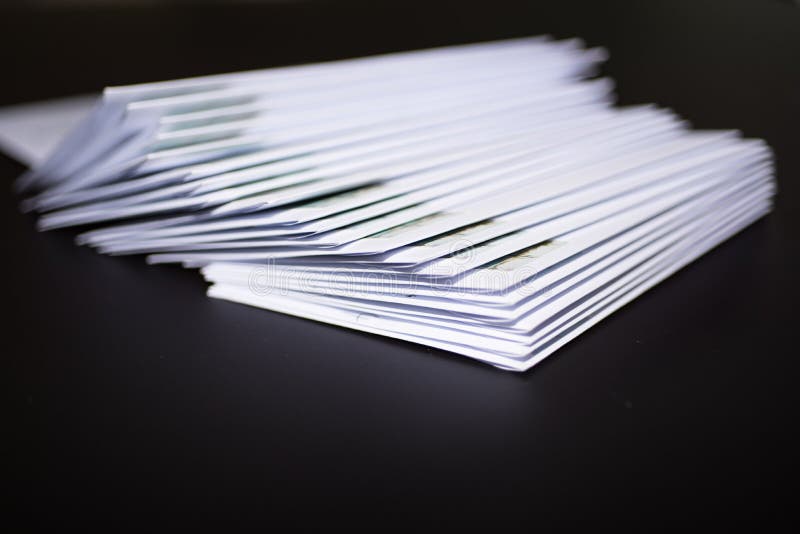 Stack of Franked Letters in White Envelopes on Black Background Stock ...