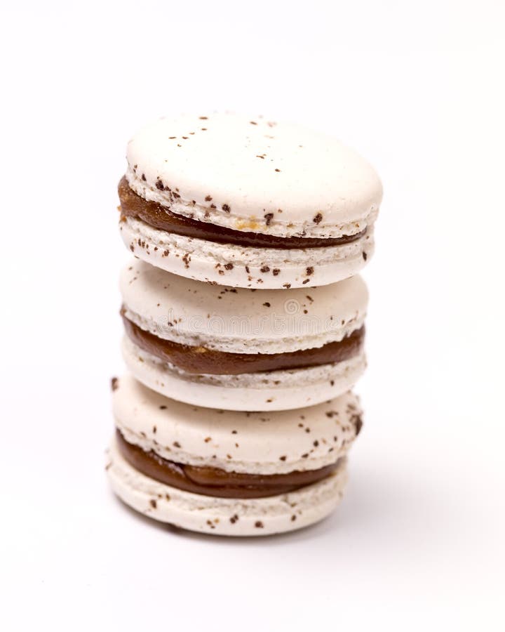 Stack of French Caramel Macarons Three White Macarons on White ...