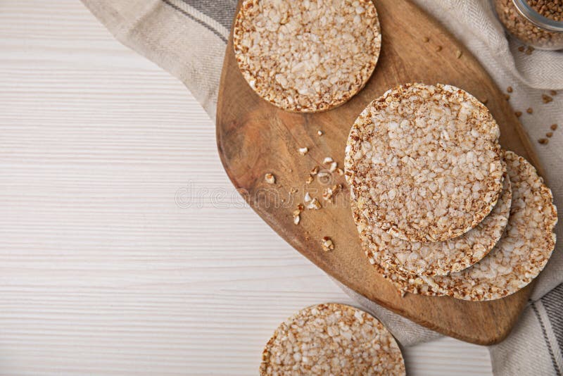 Stack of Fresh Crunchy Rice Cakes on White Wooden Table, Flat Lay ...