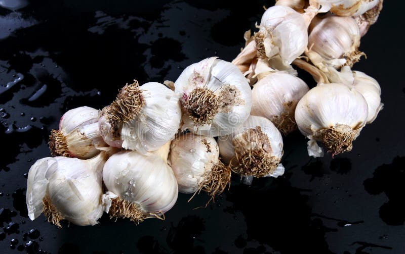 Stack of fresh garlics stock photo. Image of freshness - 25803504
