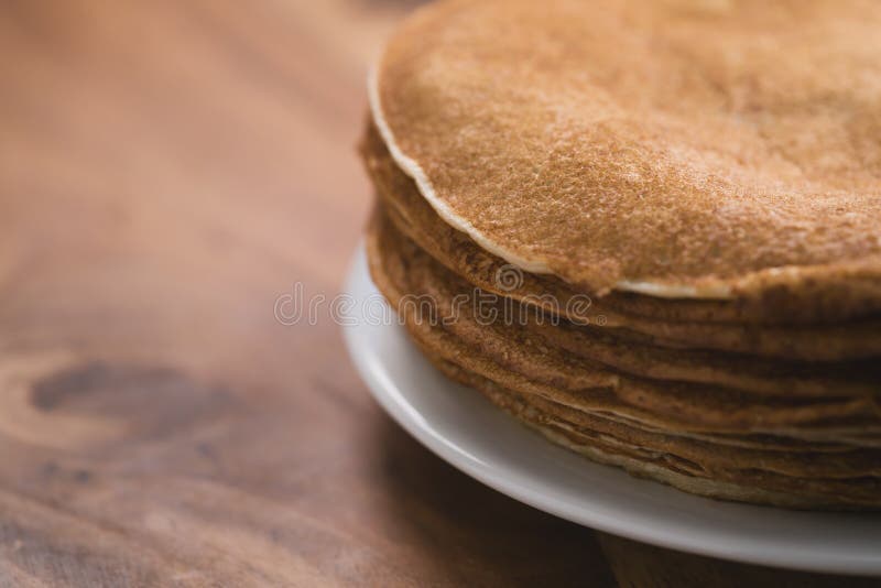 Stack of Fresh Hot Crepes or Blinis on Wood Table with Copy Space Stock ...