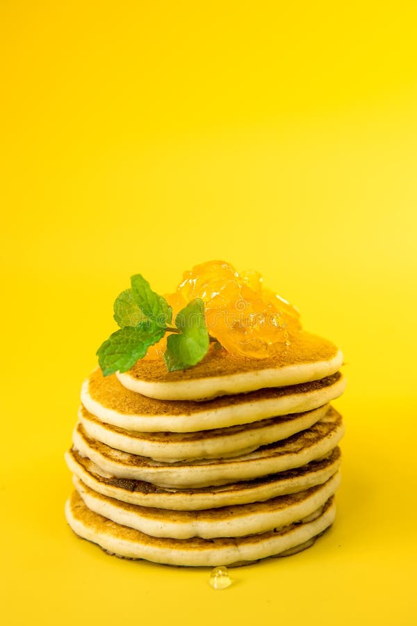 Stack of Freshly Home Made Pancakes Isolated Over Bright Yellow ...