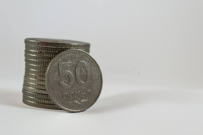 Stack of Georgian Lari Coins with a 50 Lari Coin Leaning on it on a ...