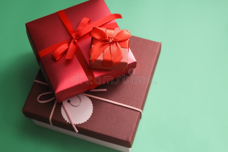 A Stack of Gift Boxes on a Green Surface. Stock Image - Image of ...