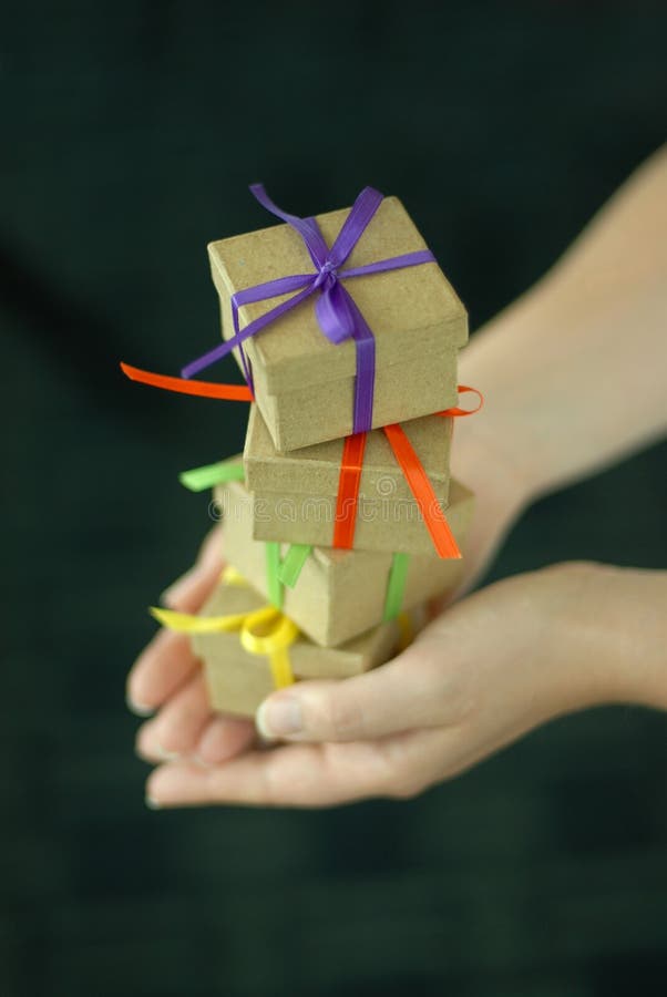 Stack of Gifts stock photo. Image of hands, package, occasion - 991046