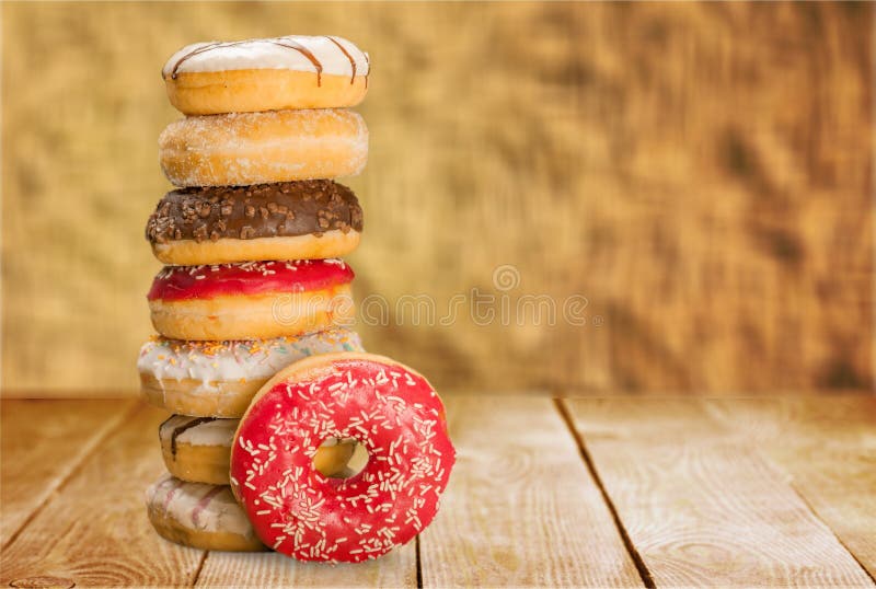 Stack of Glazed Doughnuts on Light Blurred Stock Photo - Image of ...