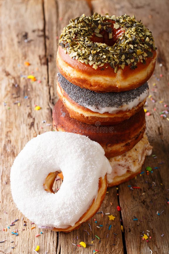 Stack of Glazed Multicolored Donuts Close-up. Vertical Stock Image ...
