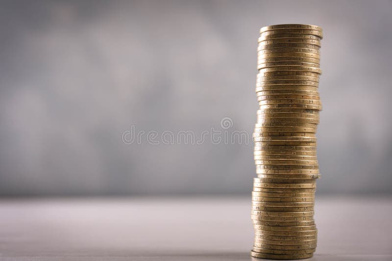 Stack of Gold Coins on a Gray Background. Front View Stock Image ...