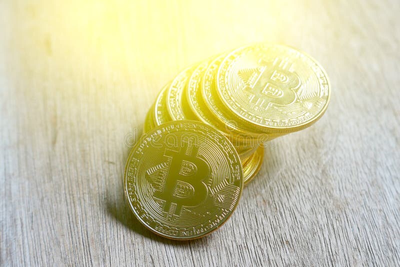 Stack of Golden Bitcoin Replica with Sun Flare.Business and Finance ...