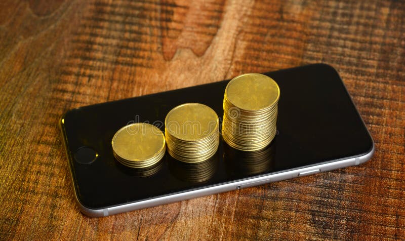 Stack of Golden Coins on Mobile Screen - Earning Concept Stock Photo ...