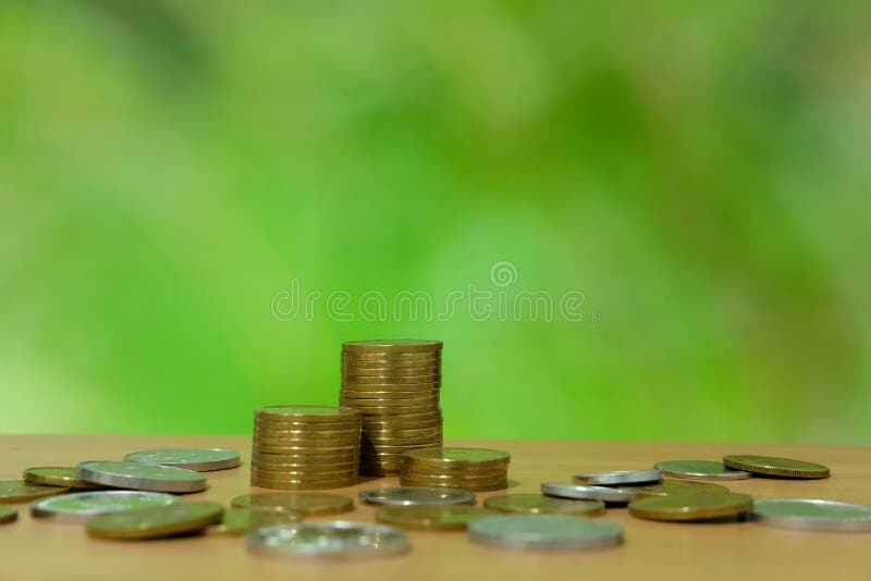 Stack of Golden Money Coin on a Wooden Table Stock Photo - Image of ...