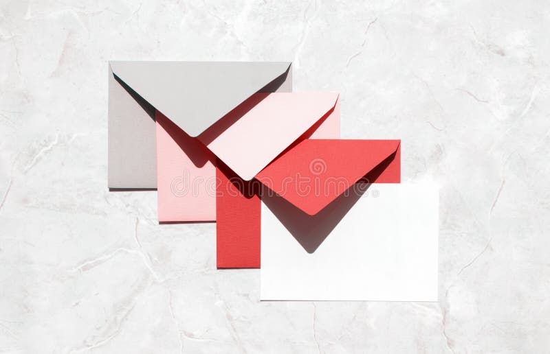 Stack of Gray, Pink, Red Mail Envelopes and Empty White Paper Card on ...