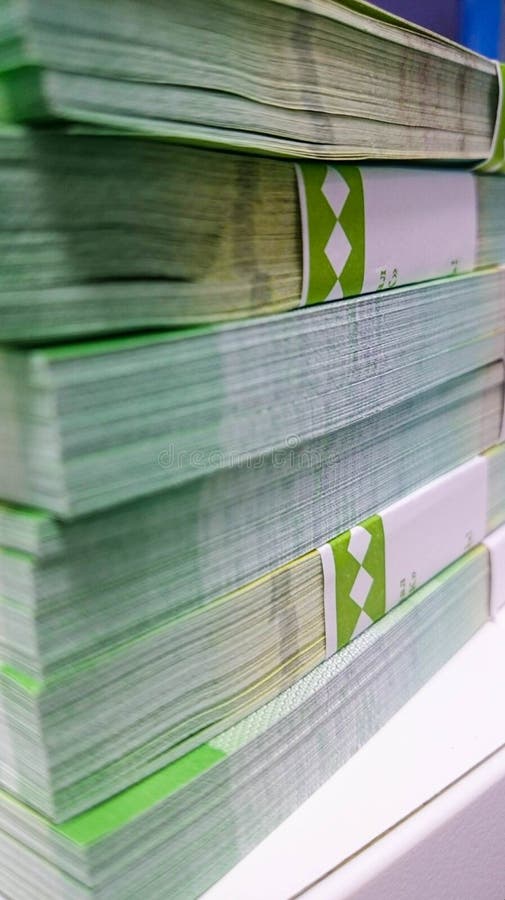 A Stack of Green Bills that are Stacked on Top of Each Other and Packed ...