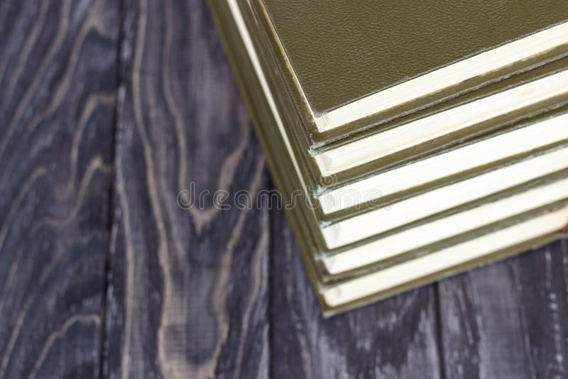 A Stack of Green Books on a Wooden Table. Concept of Reading Habits ...