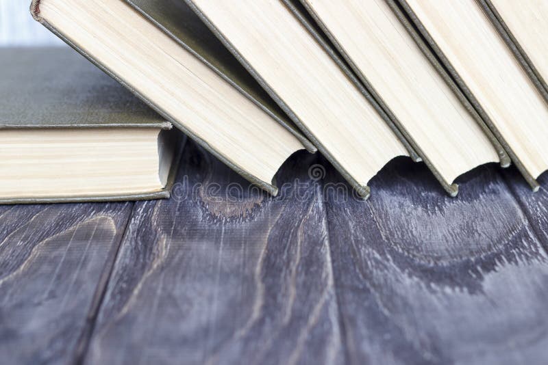 A Stack of Green Books on a Wooden Table. Concept of Reading Habits ...