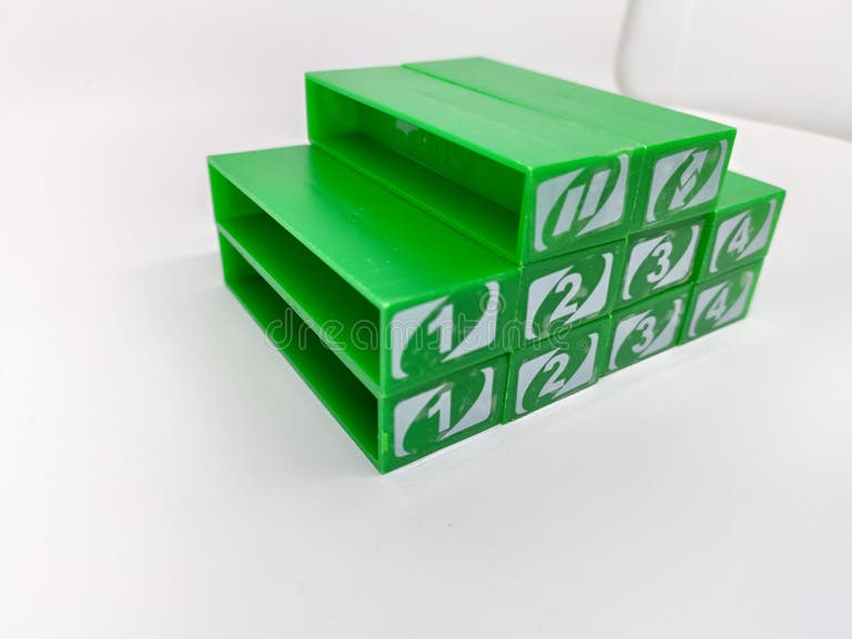 Stack of Green Plastic Numbered Organizers with White Background Stock ...