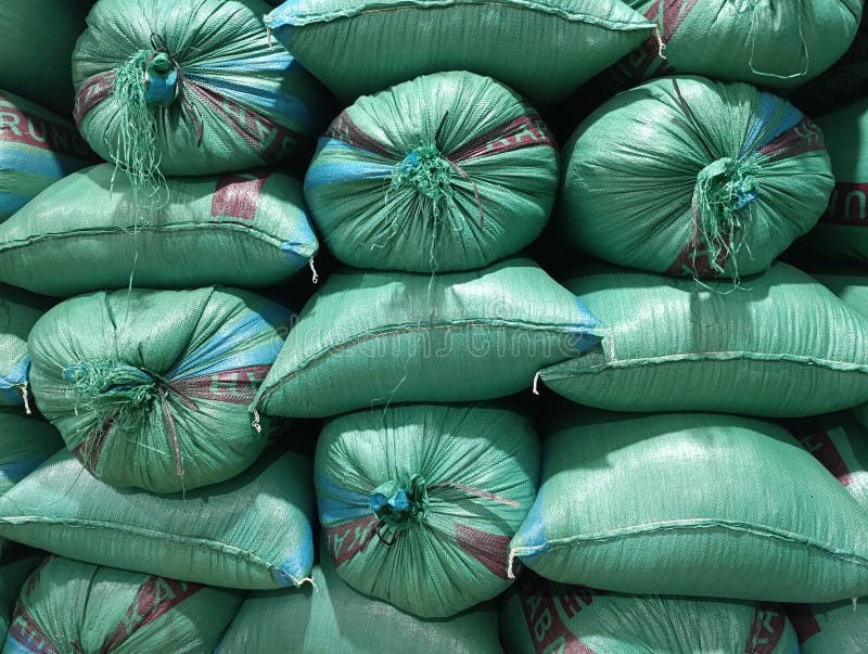 Stack of green sacks stock image. Image of sacks, stack - 381278303