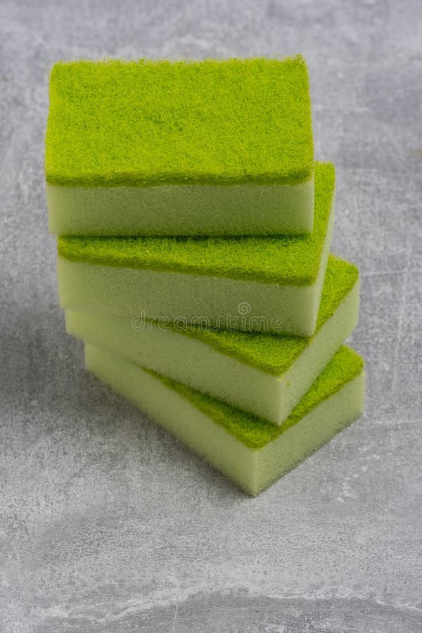 Stack of Green Sponges for Cleaning on a Grey Background Stock Photo ...