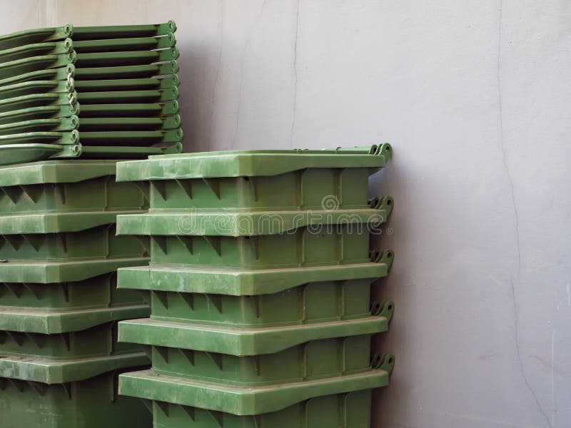 Stack of green trash bins stock photo. Image of storage - 89427634
