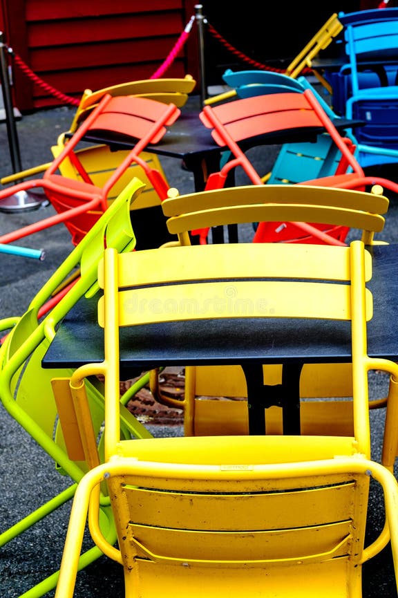 Stack or Group of Bright Coloured Chairs in a Cafe Outside Seating Area ...
