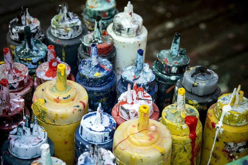 Stack of Grungy Oil Color Paint Bottle on Table Stock Image - Image of ...