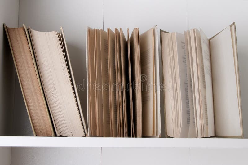 Stack of Hardback Books on Wooden Bookshelf Stock Photo - Image of ...