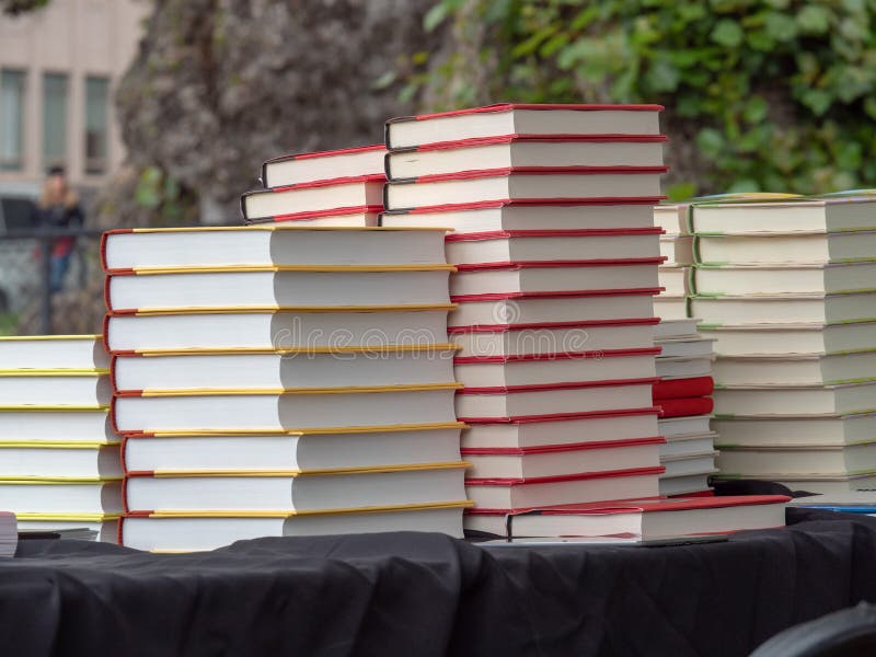 Stack of Hardcover Books Sitting on an Outdoor Table Stock Photo ...