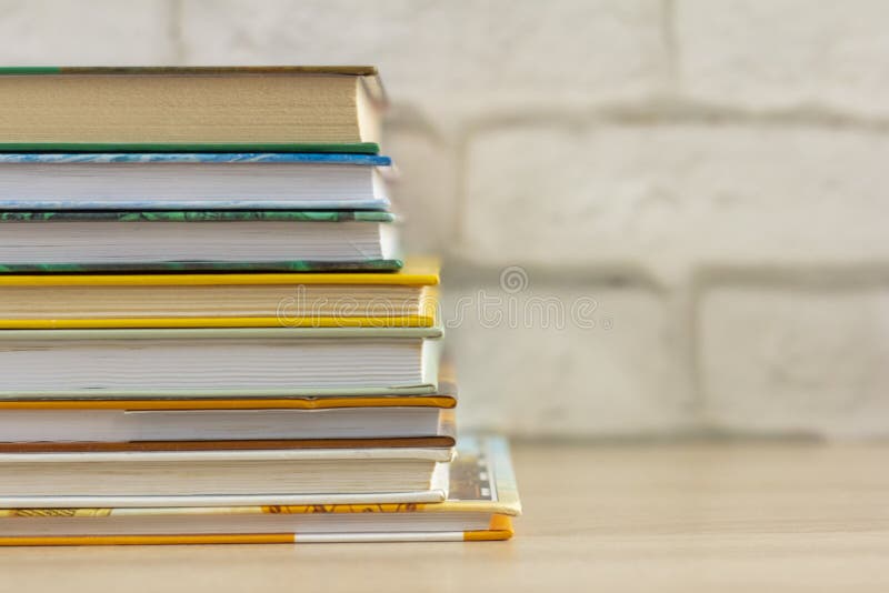 A Stack of Hardcover Books on a Table or Shelf in the Library Room ...