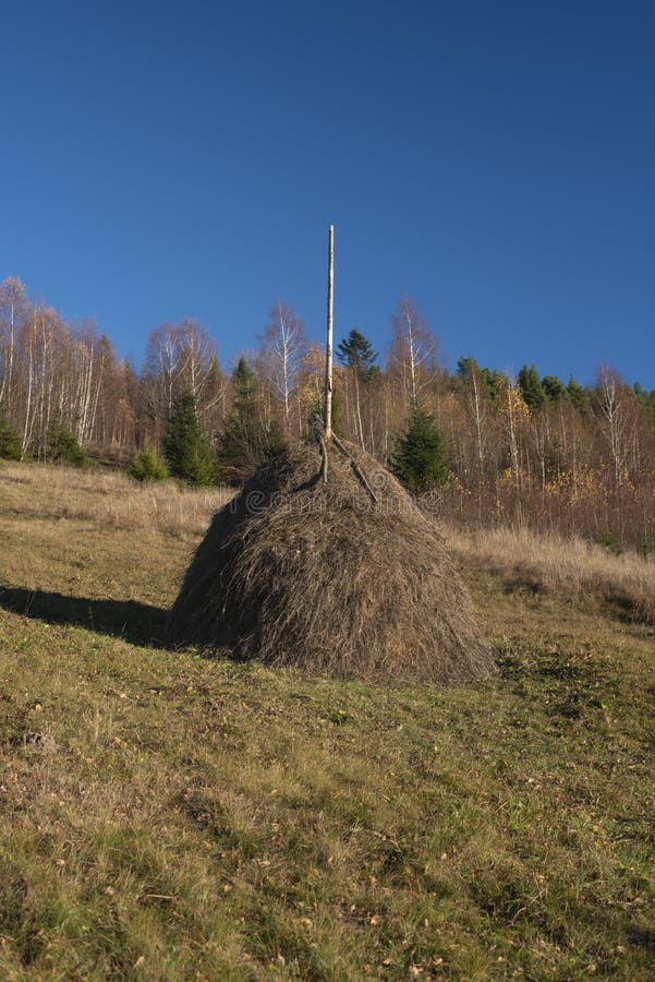 Stack of Hay on the Mountain Hill on a Beautiful Autumn Day Stock Image ...
