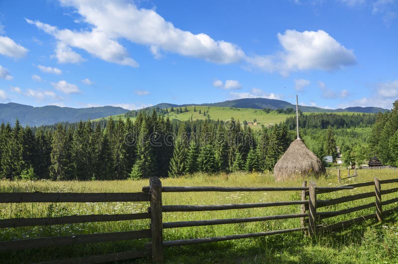 Stack of Hay on a Mountain Meadow on a Hillside Stock Image - Image of ...