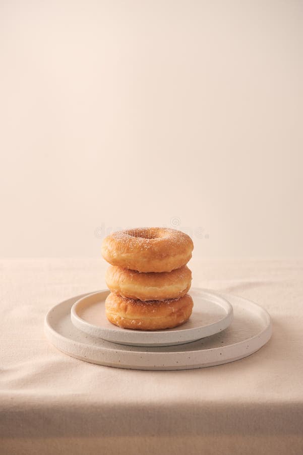 Stack of Homemade Baked Donuts Sitting on White Plate Stock Photo ...