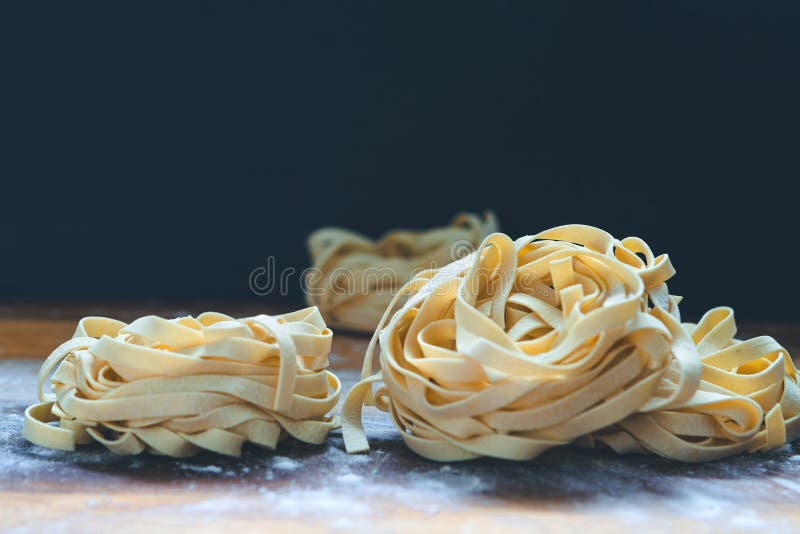 Stack of Homemade Nest-shaped Pasta on Wooden Table Stock Image - Image ...