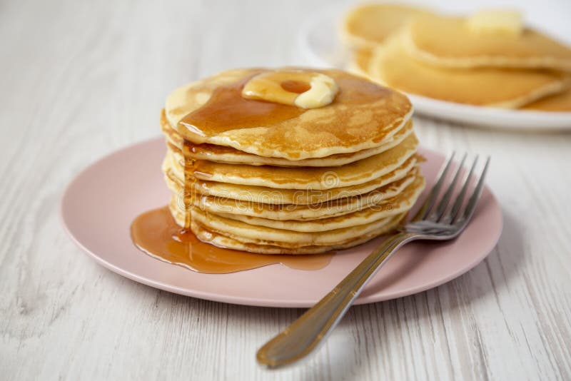 Stack of Homemade Pancakes with Butter and Maple Syrup on a Pink Plate ...