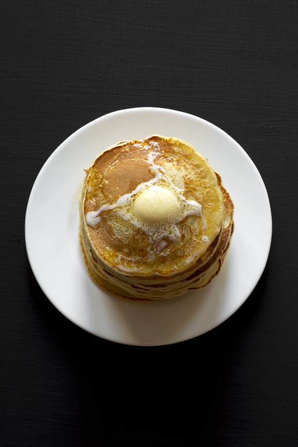 Stack of Homemade Pancakes with Butter on White Plate on Black Table ...
