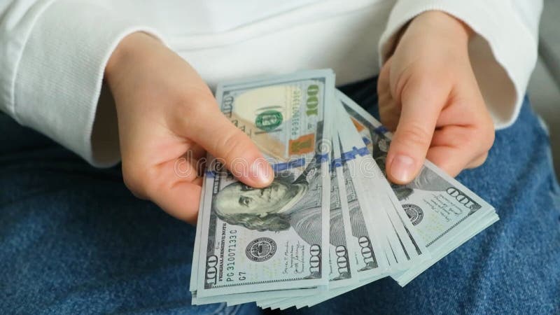 A Stack of Hundred-dollar Bills in Hands, the Concept of Accumulating ...