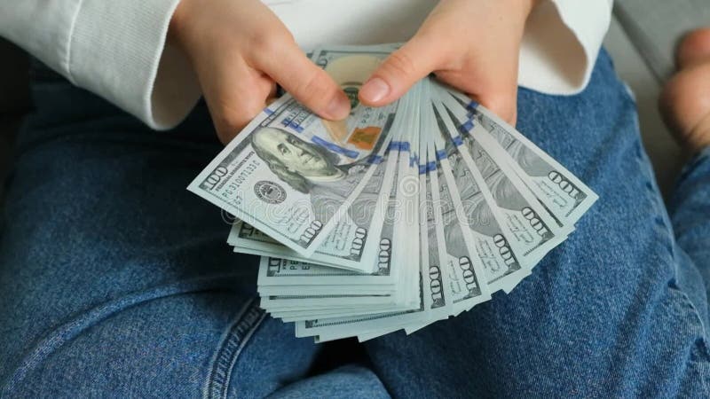 A Stack of Hundred-dollar Bills in Hands, the Concept of Accumulating ...