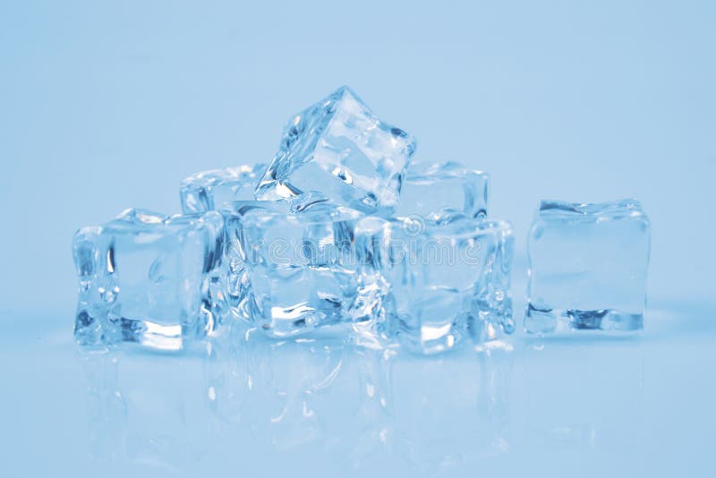 Stack of ice cubes on blue stock photo. Image of object - 183549334