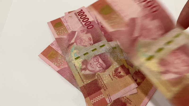 Stack of 100000 Indonesian Rupiah Notes Isolated on White Background ...