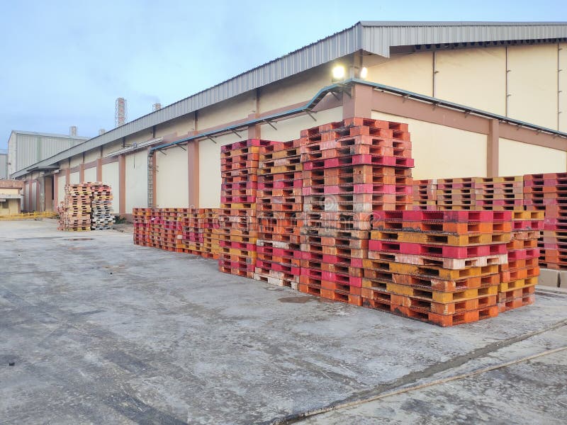 Stack of Industrial Plastic Pallets Stock Image - Image of beach, brick ...